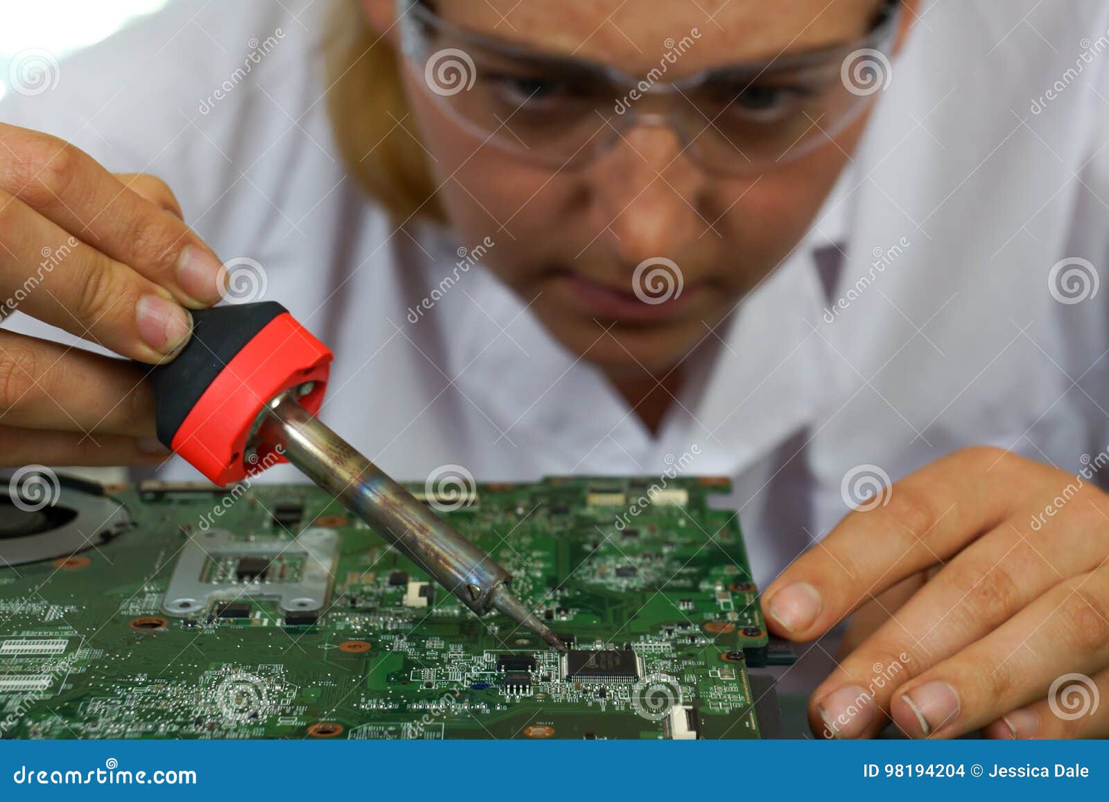 A Female Computer Engineer at Work Stock Photo - Image of board, device ...
