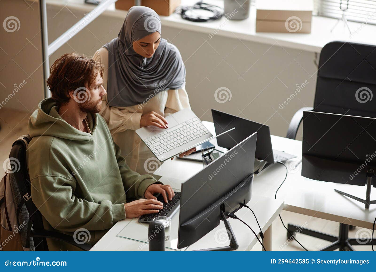 Female Computer Programmer Wearing Headscarf in Office during Code ...