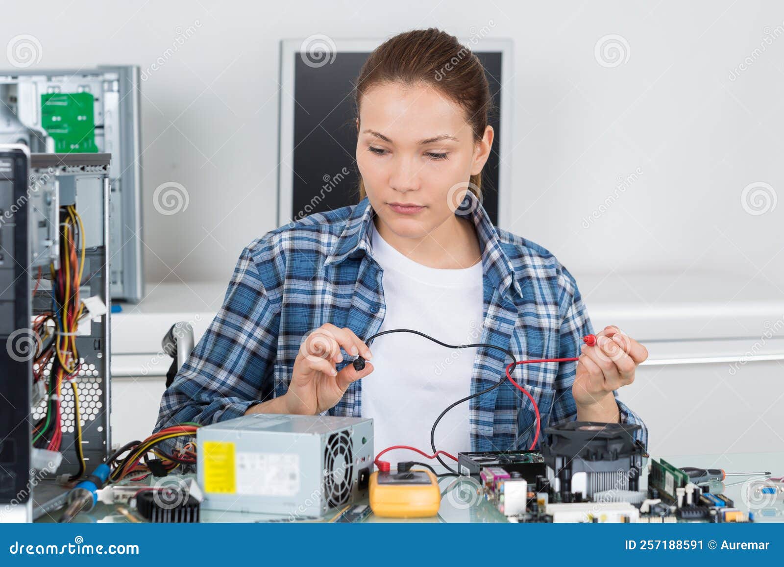 Female Computer Technician Using Multimeter Stock Image - Image of ...