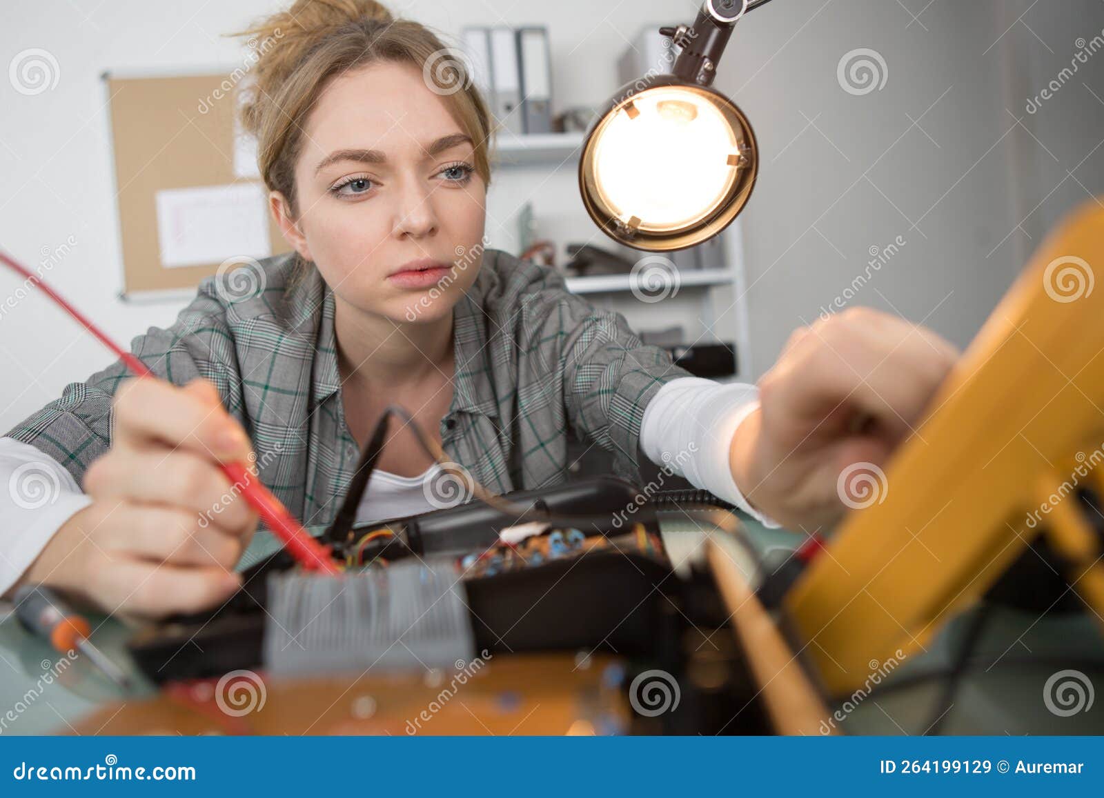 Female Computer Technician Using Multimeter Stock Image - Image of ...