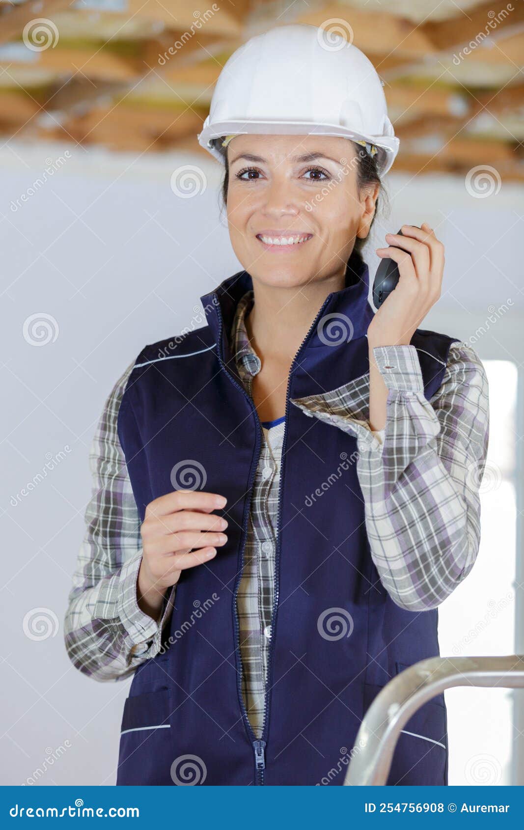Female Construciton Worker Using Walkie Talkie Stock Photo - Image of ...