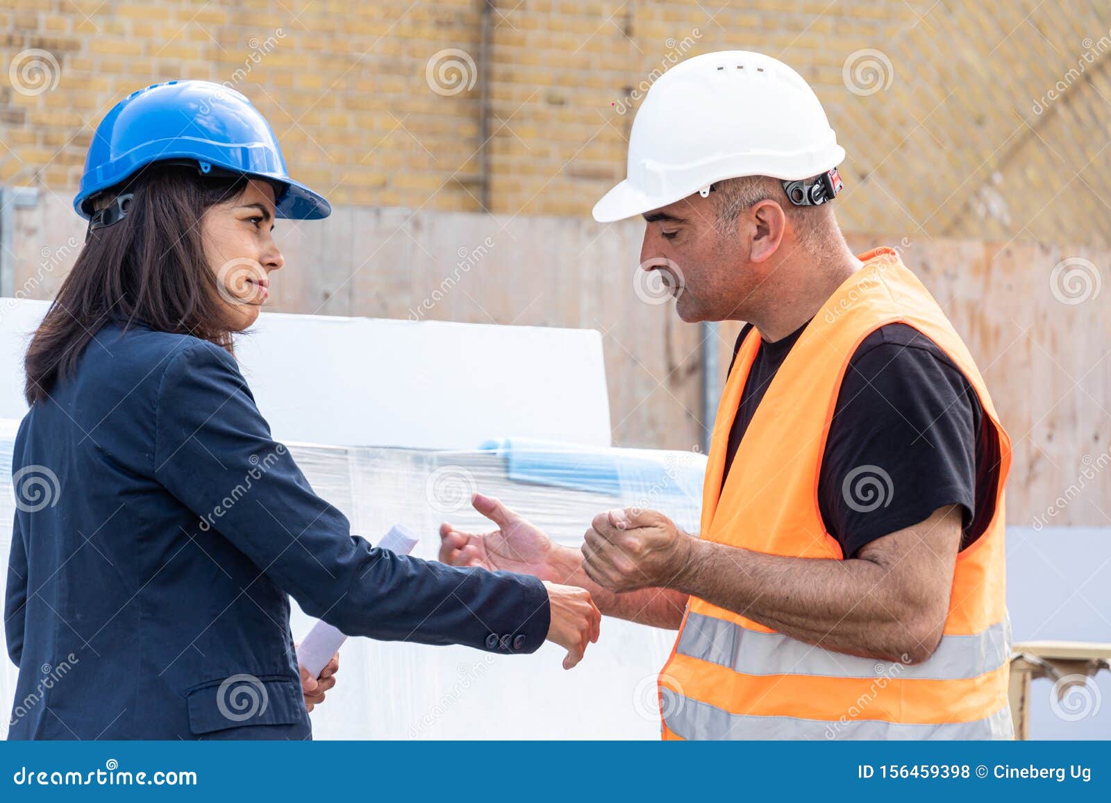 Female Construction Boss Talking To a Foreman Stock Photo - Image of ...