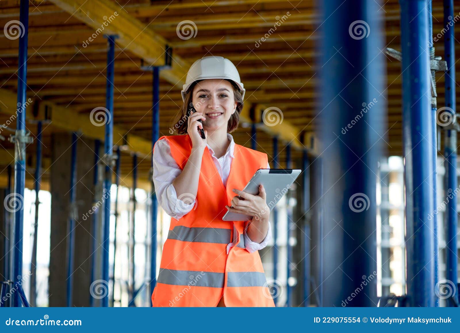 Female Construction Engineer. Architect with a Tablet Computer at a ...