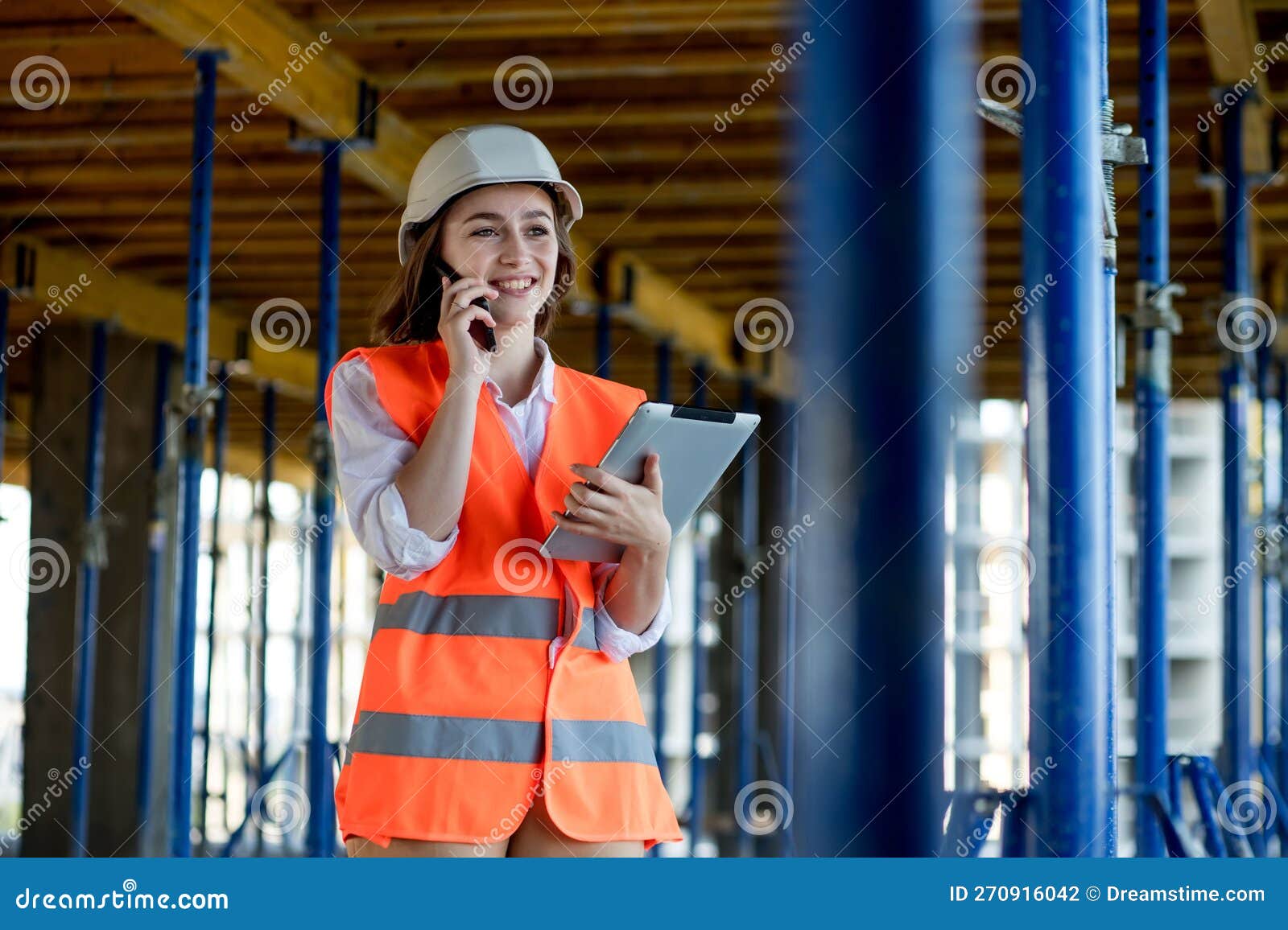 Female Construction Engineer. Architect with a Tablet Computer at a ...