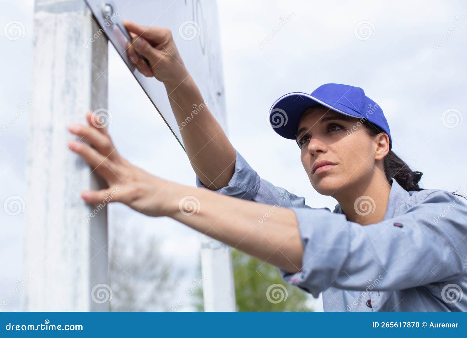 Female Construction Holding Level Stock Photo - Image of orange ...