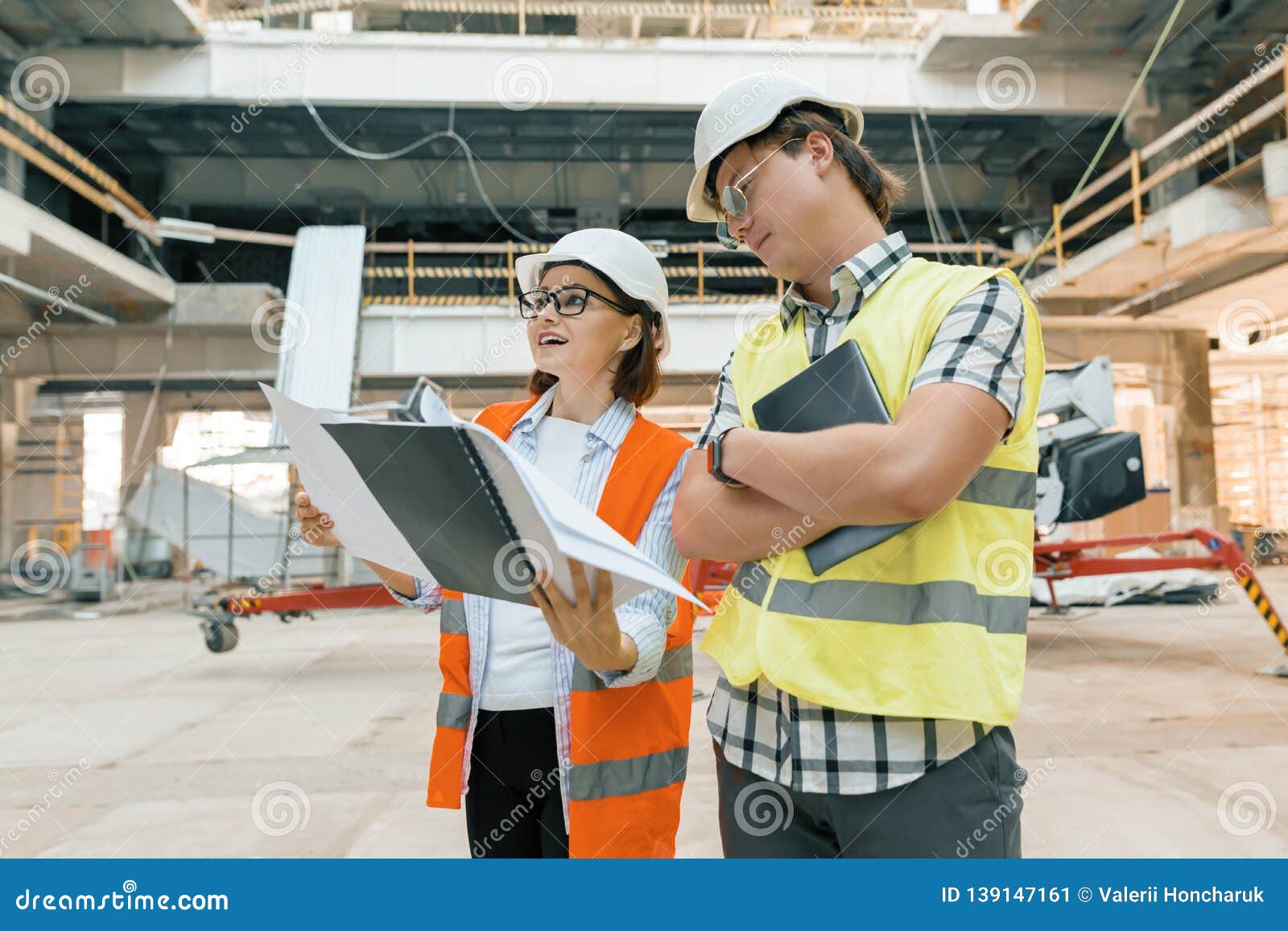 Female Construction Inspector Examining Construction Site. Building ...