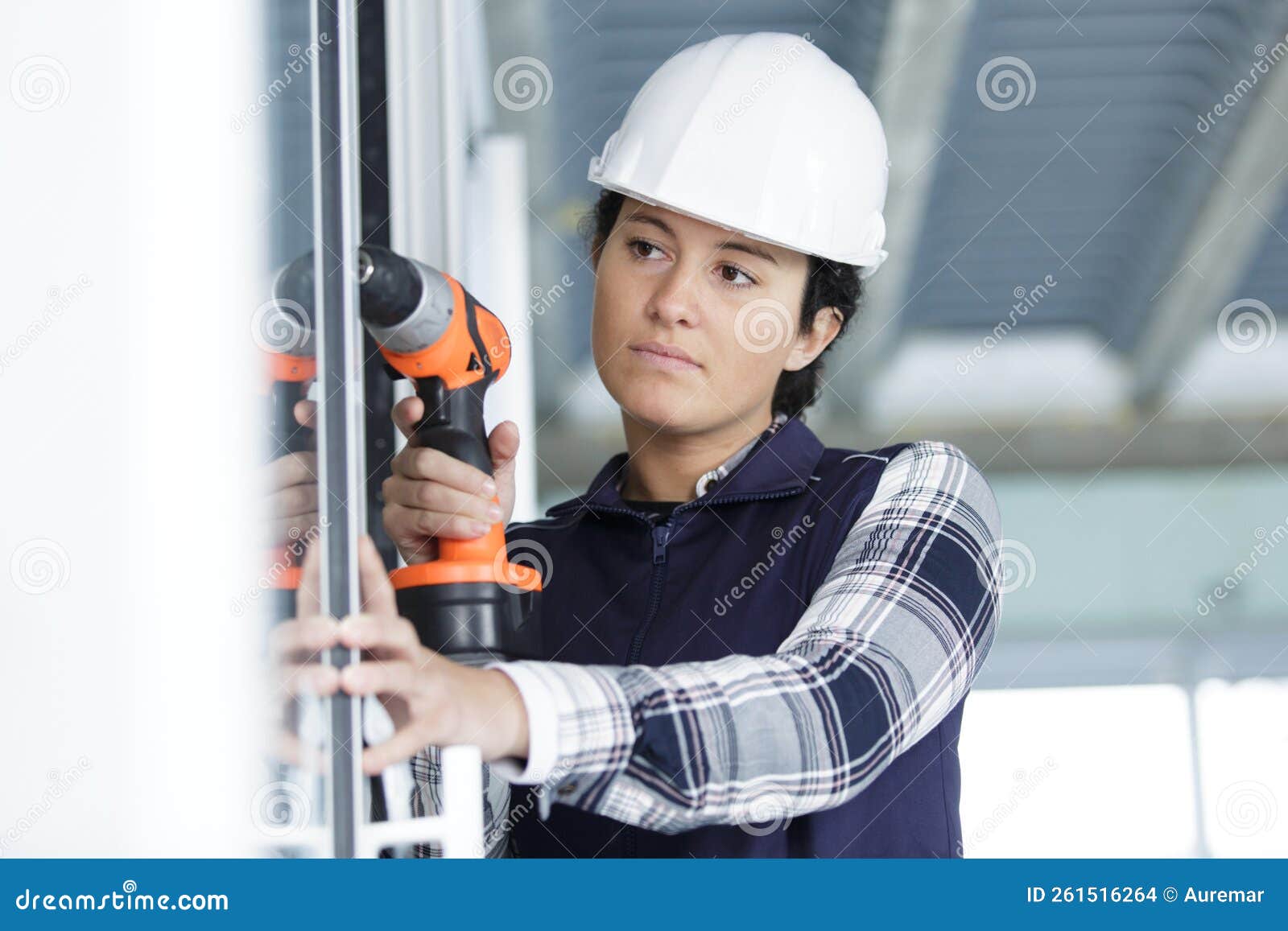 Female Construction Worker Drilling Window Stock Photo - Image of ...