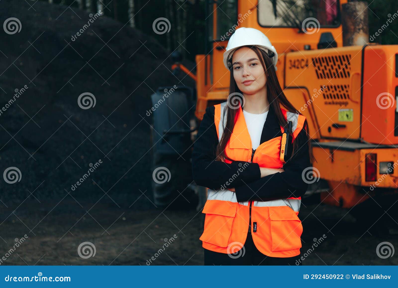 Female Construction Worker Engineer with a Front Loader Machine on ...
