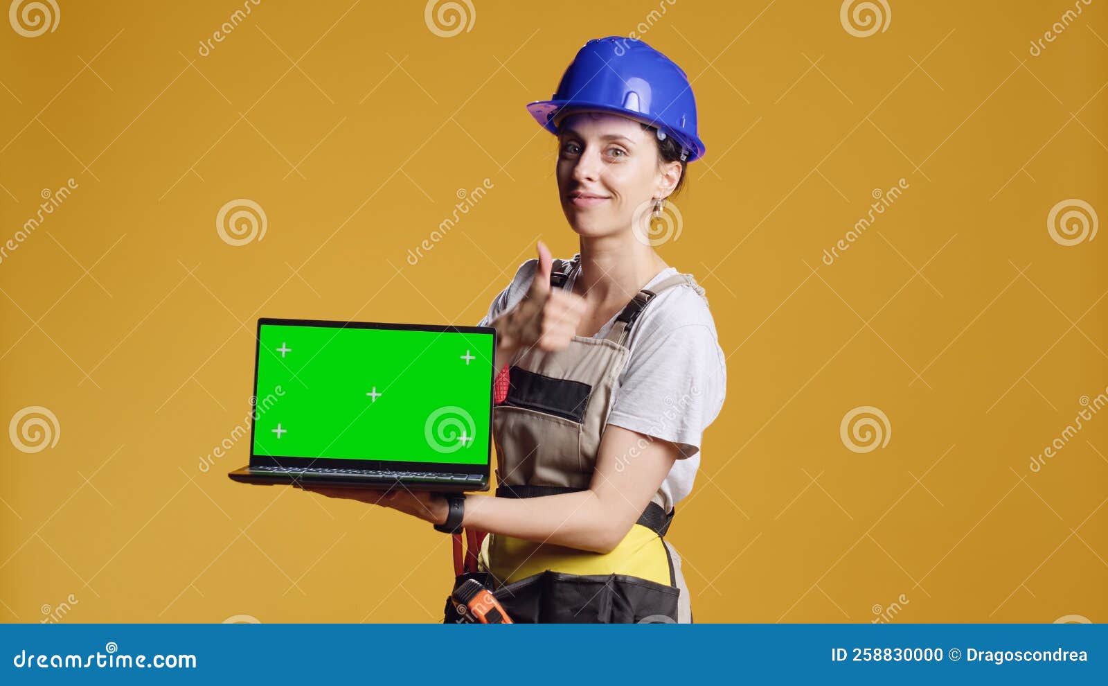 Female Construction Worker Holding Laptop with Greenscreen Stock Photo ...