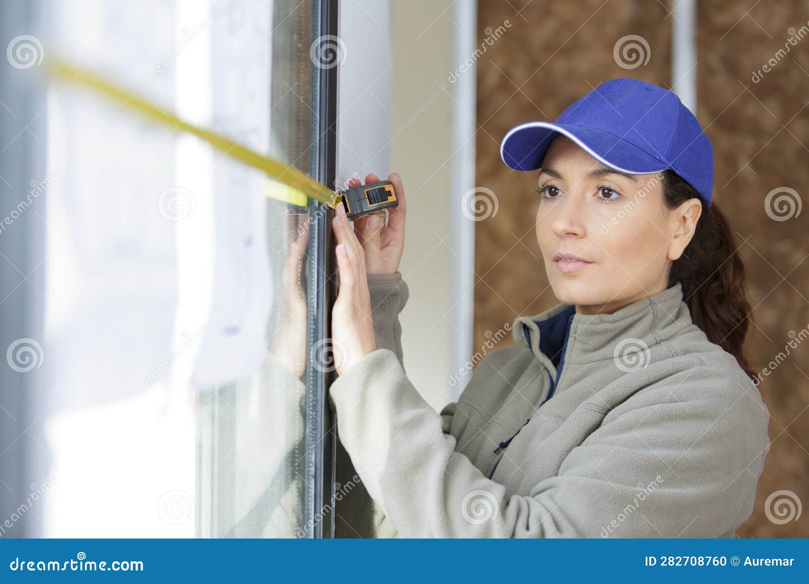 Female Construction Worker Installing New Windows Stock Photo - Image ...