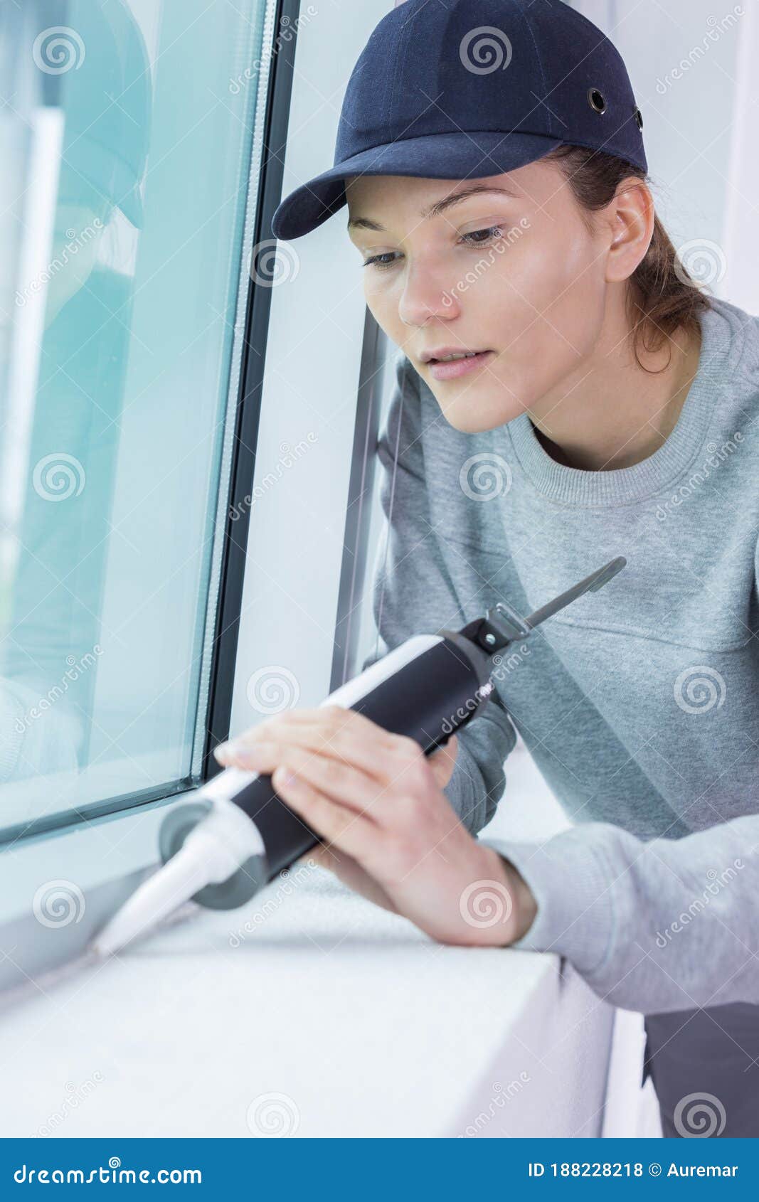 Female Construction Worker Installing Window in House Stock Photo ...