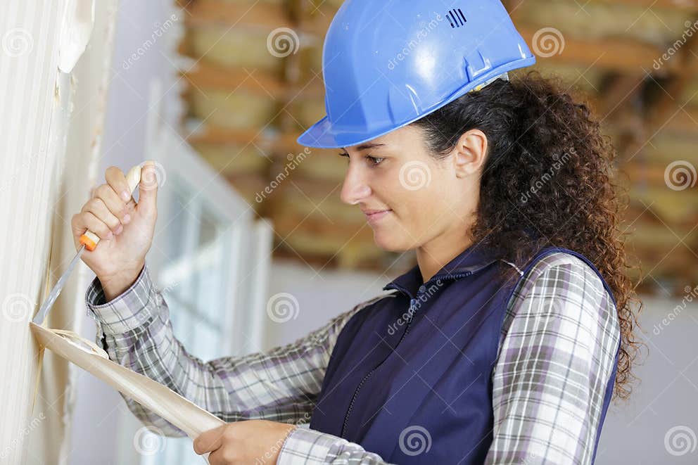 Female Construction Worker Removing Wallpaper with Scraper Stock Image ...