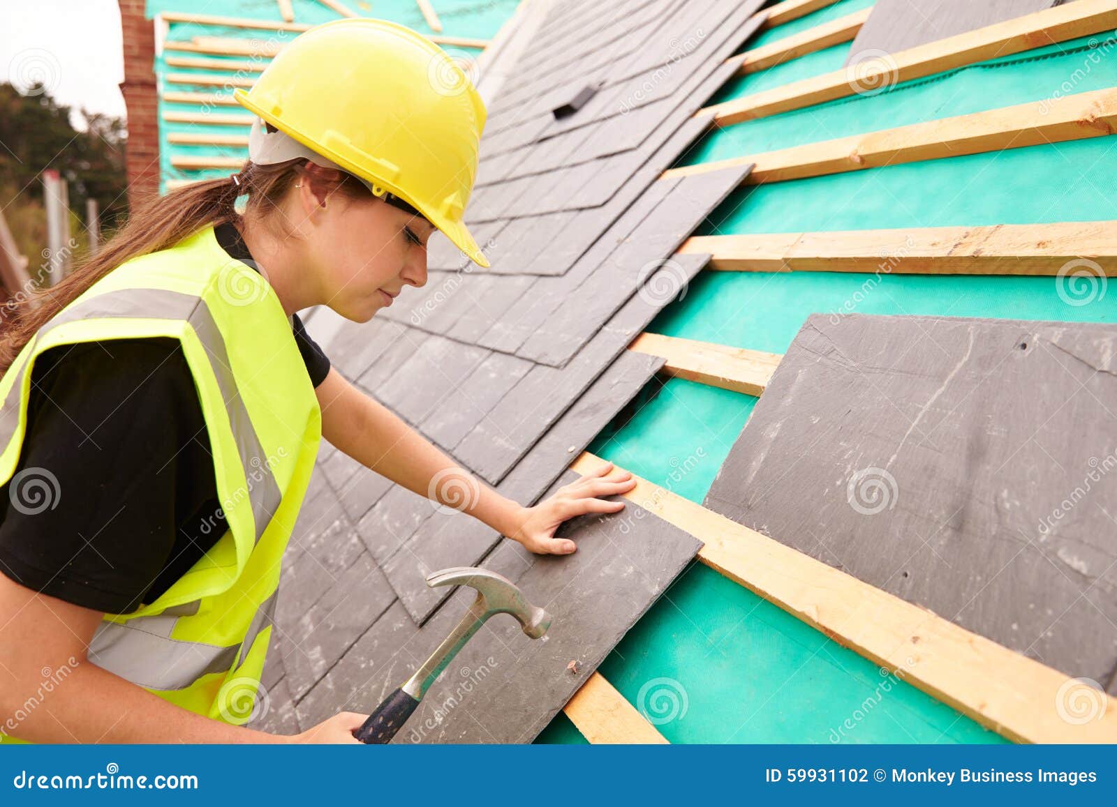 Female Construction Worker on Site Laying Slate Tiles Stock Photo ...