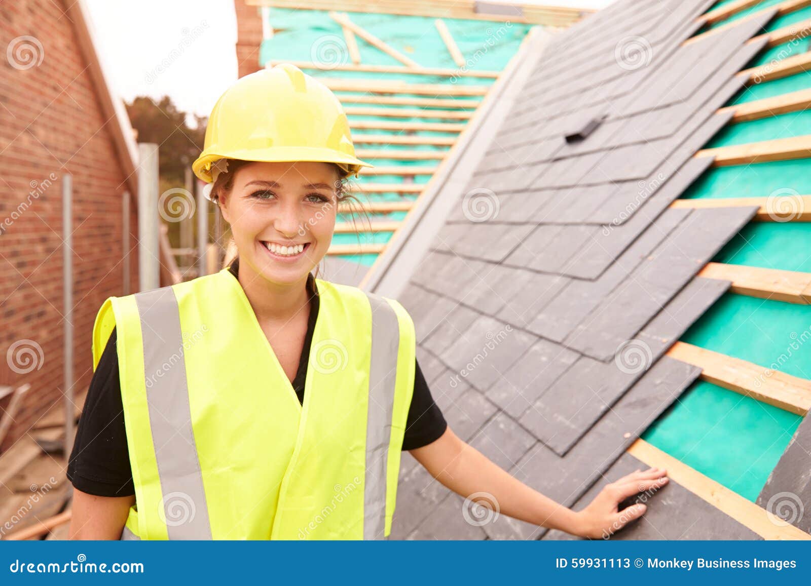 Female Construction Worker on Site Laying Slate Tiles Stock Image ...