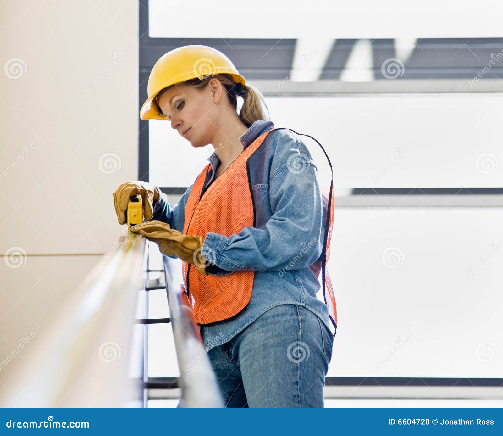 Female Construction Worker Taking Measurement Stock Photo - Image of ...