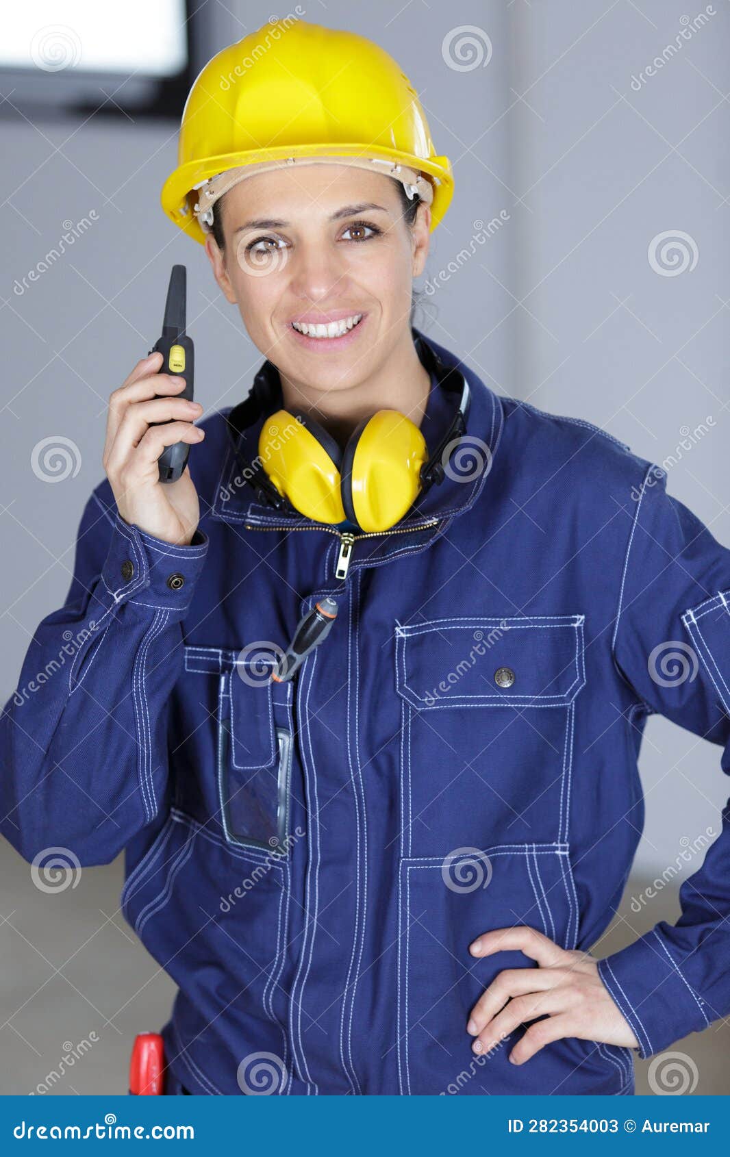 Female Construction Worker Using Walkie-talkie Stock Image - Image of ...