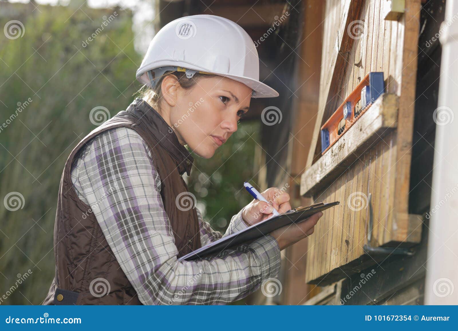 Female Constructor Working with Level on Wall Stock Photo - Image of ...
