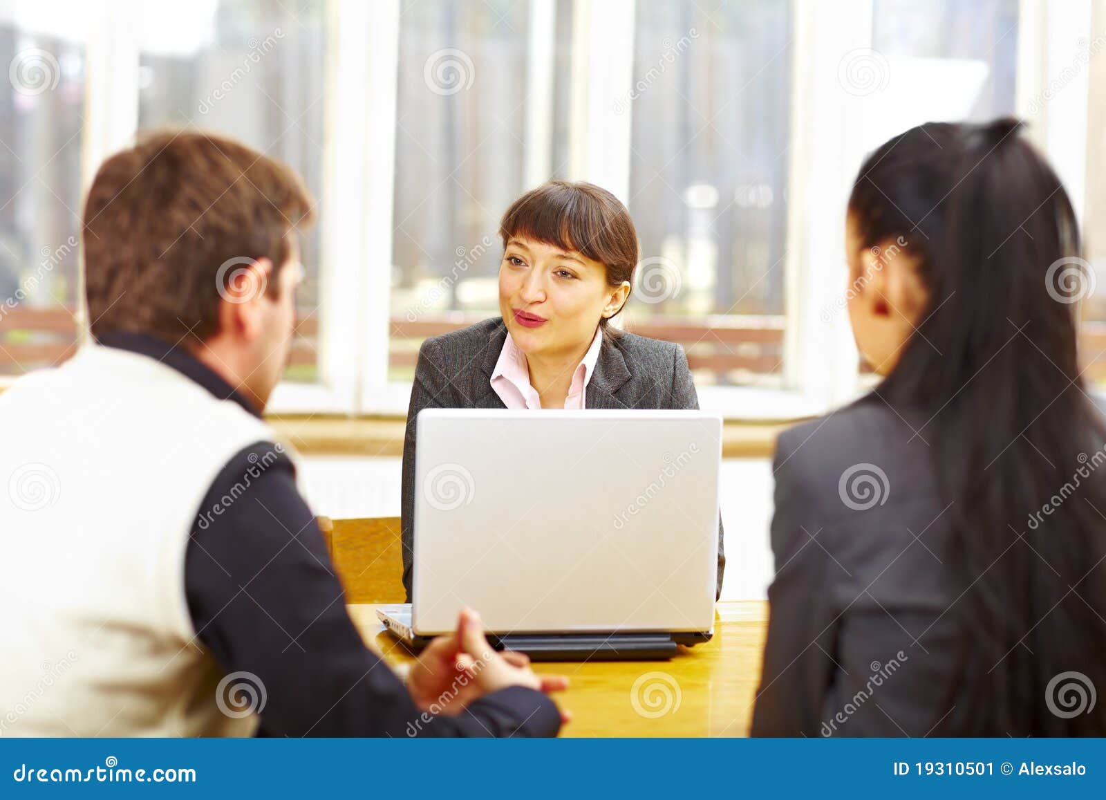 Female Consultant Advising Couple Stock Image - Image of sitting ...