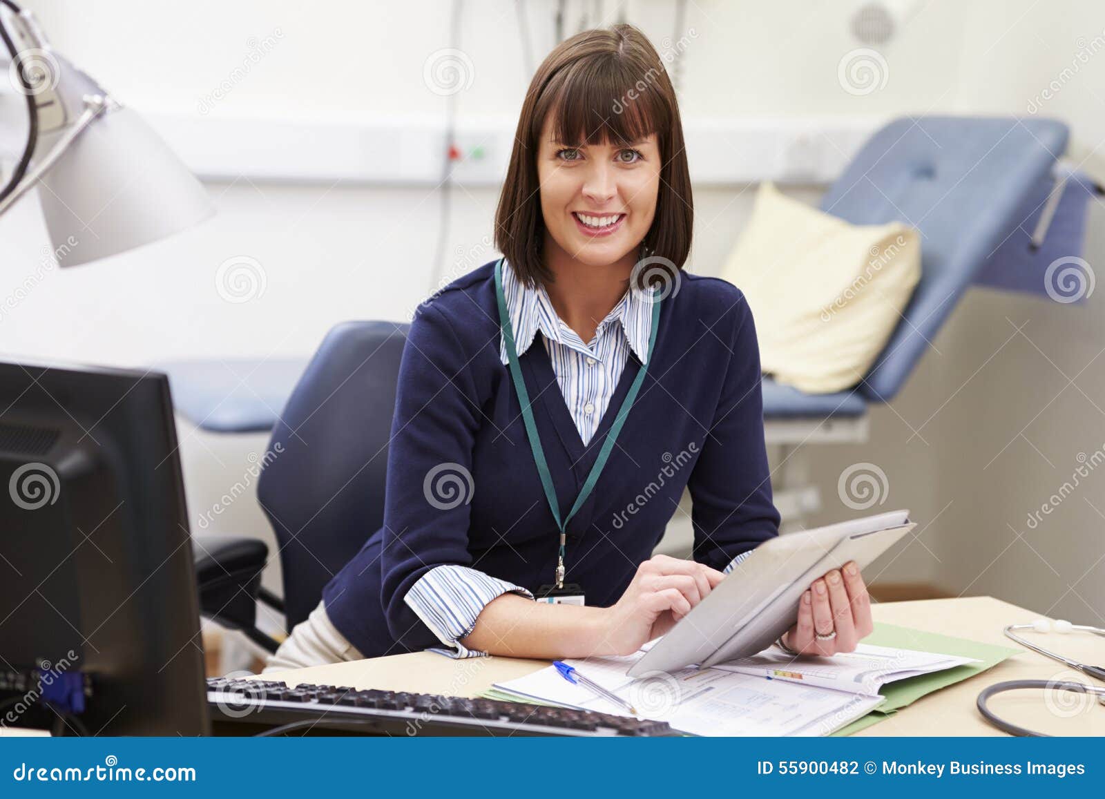 Female Consultant Using Digital Tablet at Desk in Office Stock Photo ...
