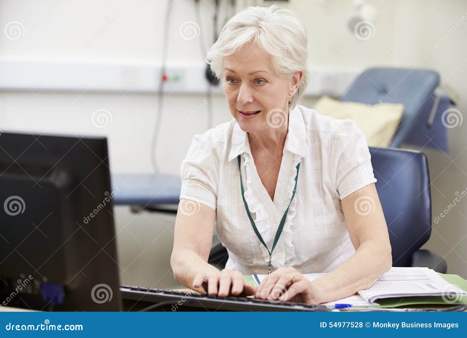 Female Consultant Working at Desk Using Digital Tablet Stock Photo ...