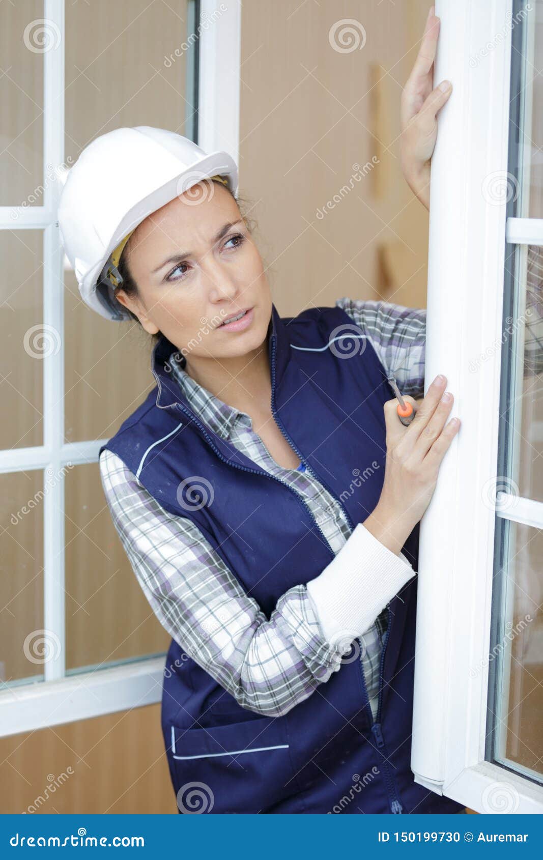 Female Contractor Adjusting Window Stock Photo - Image of installation ...