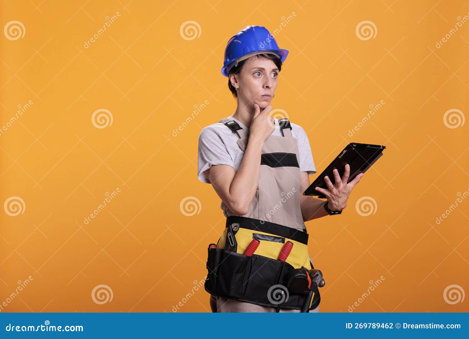 Female Contractor with Digital Tablet Browsing Internet Stock Photo ...
