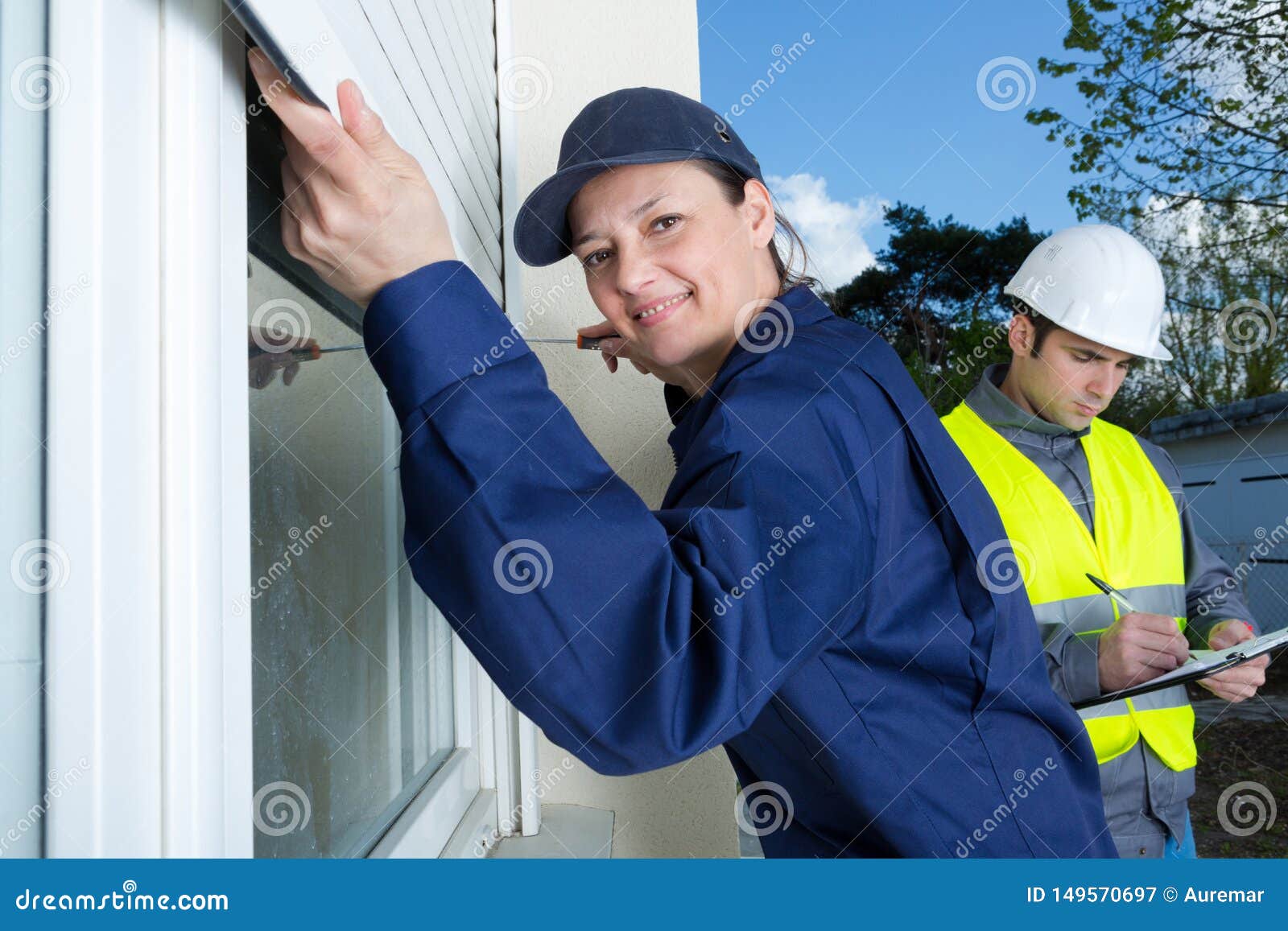 Female Contractor Installing Window Shutter Stock Image - Image of ...