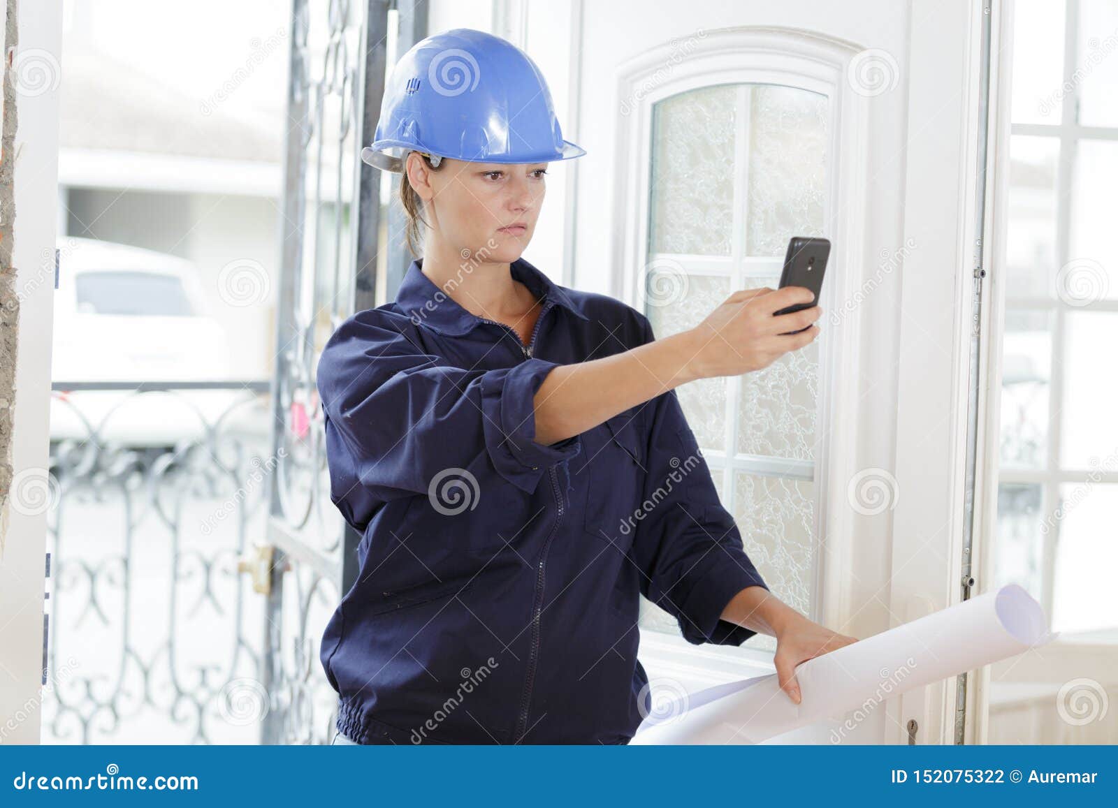 Female Contractor Taking Picture Inside Stock Photo - Image of friendly ...