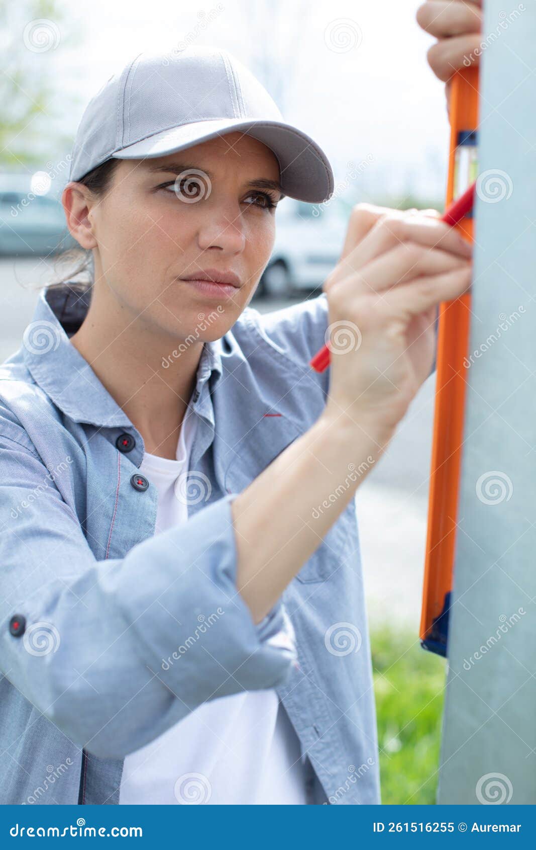 Female Contractor Using Spirit Level on Vertical Post Stock Image ...