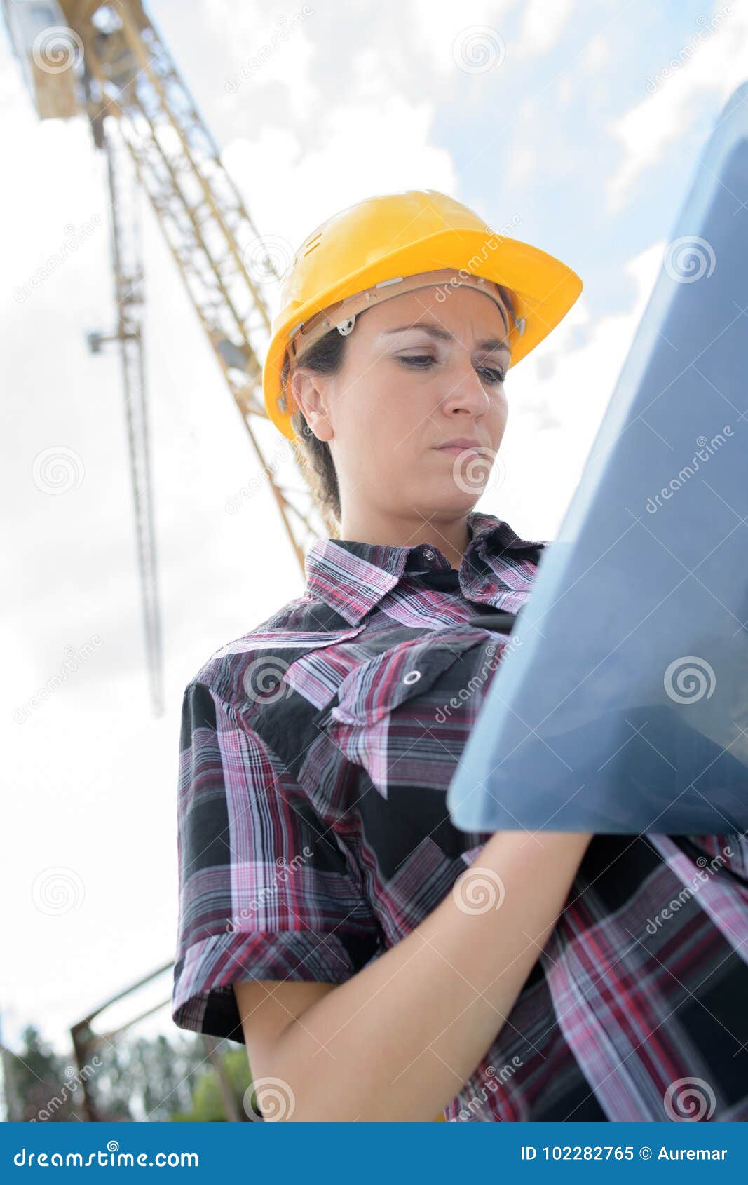 Female Contractor at Work Site Using Ipadtablet Stock Image - Image of ...
