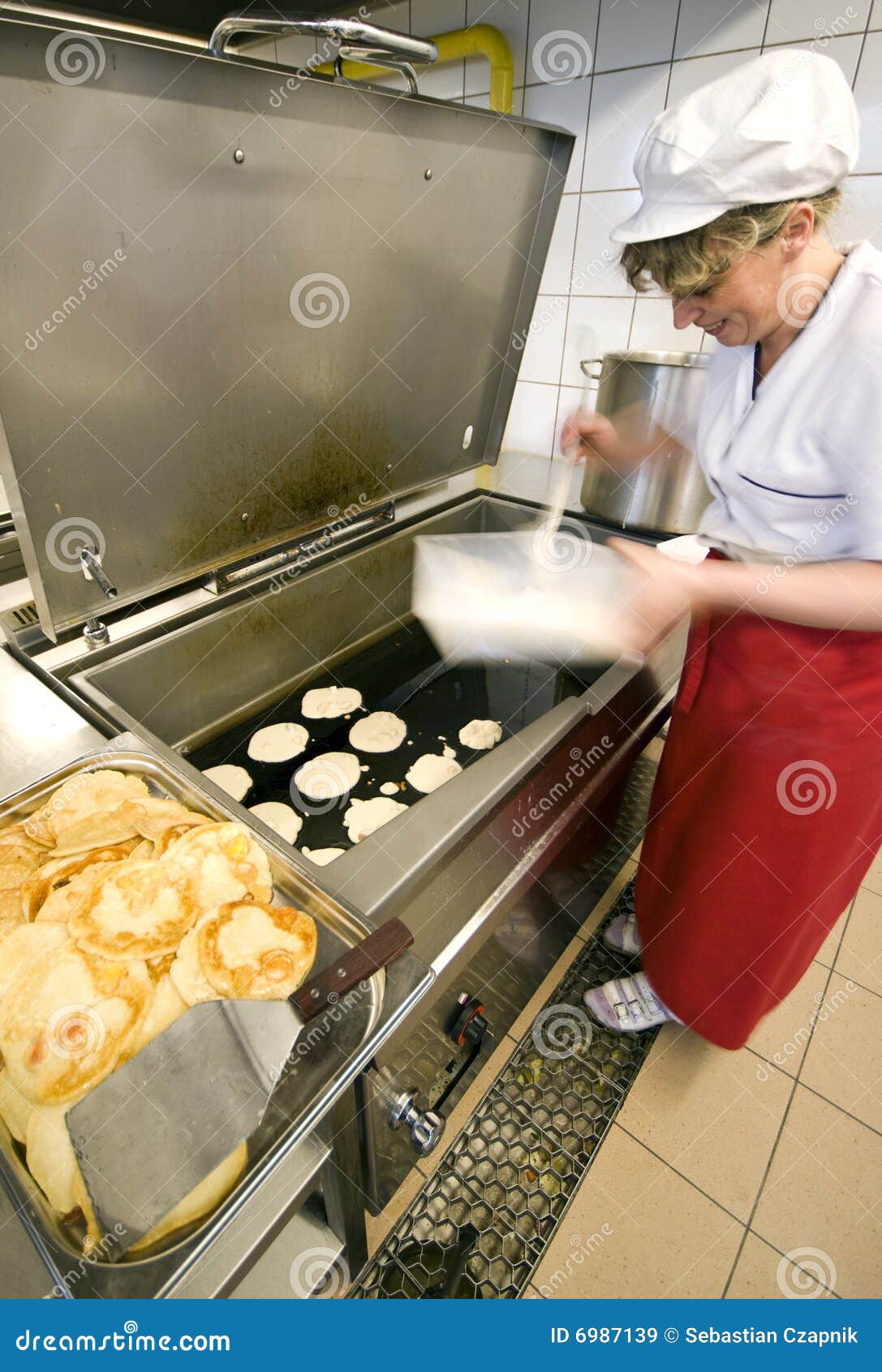 Female cook in kitchen stock image. Image of blur, action - 6987139