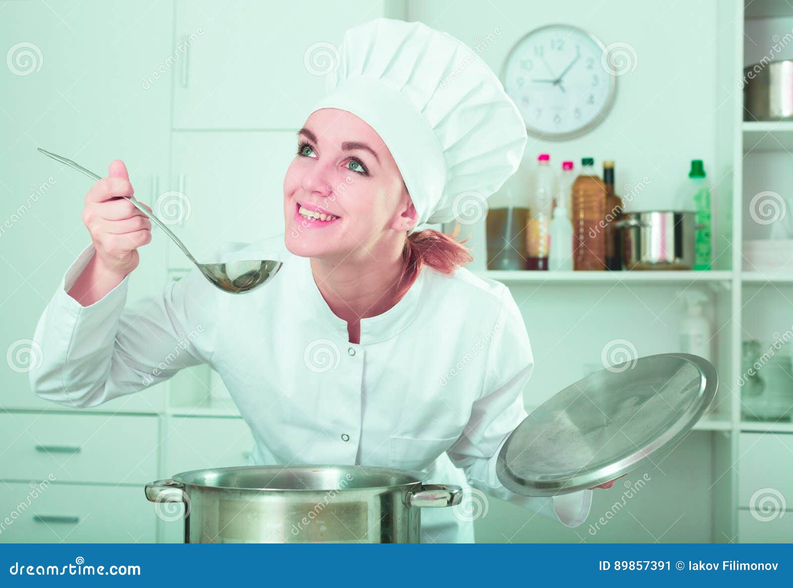 Female cook tasting food stock image. Image of practicing - 89857391