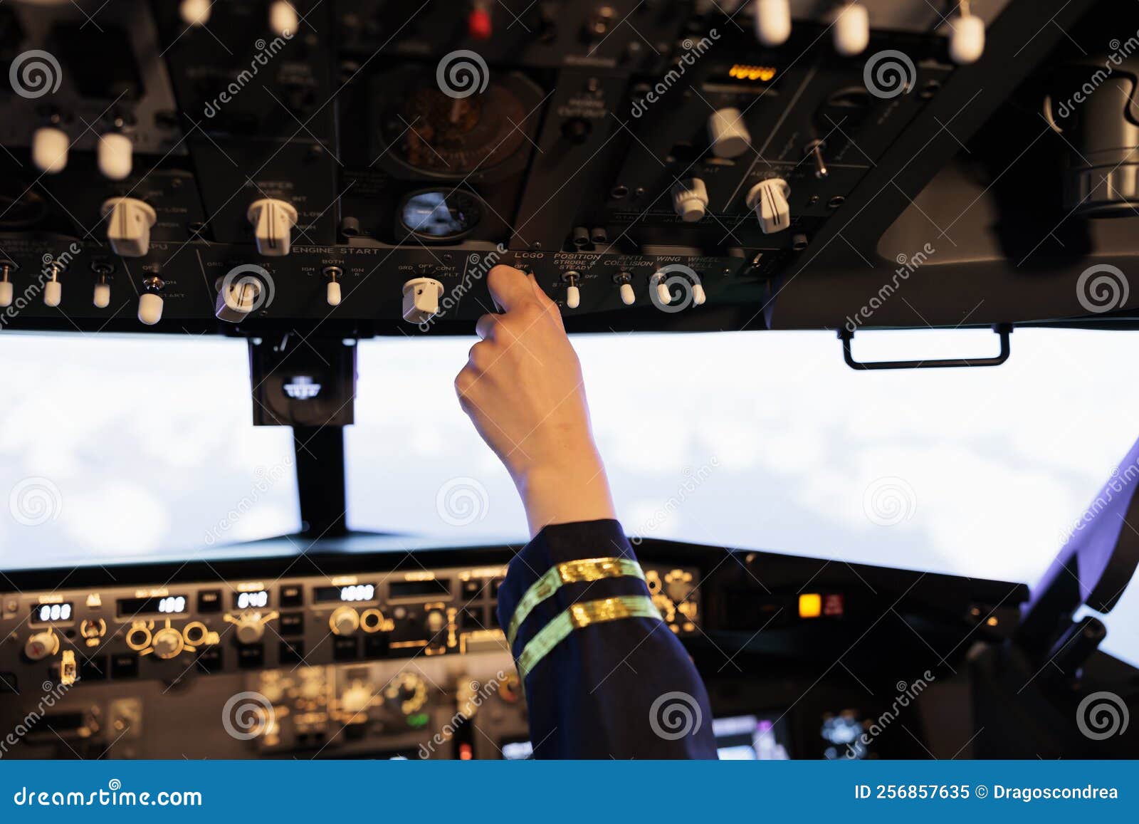 Female Copilot Pushing Dashboard Buttons In Plane Cockpit Stock Photo ...