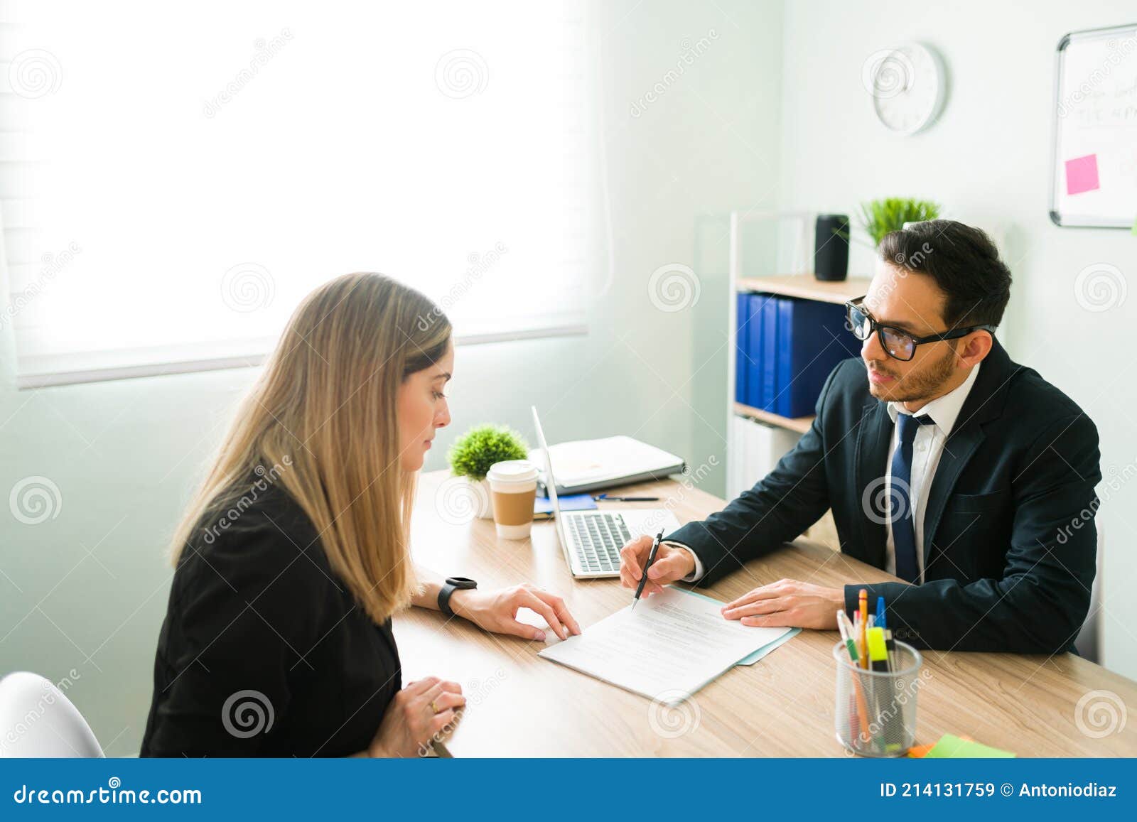 Female Coworker Checking Work Papers with a Colleague Stock Image ... Female Coworker Checking Work Papers with a Colleague Stock Image ...