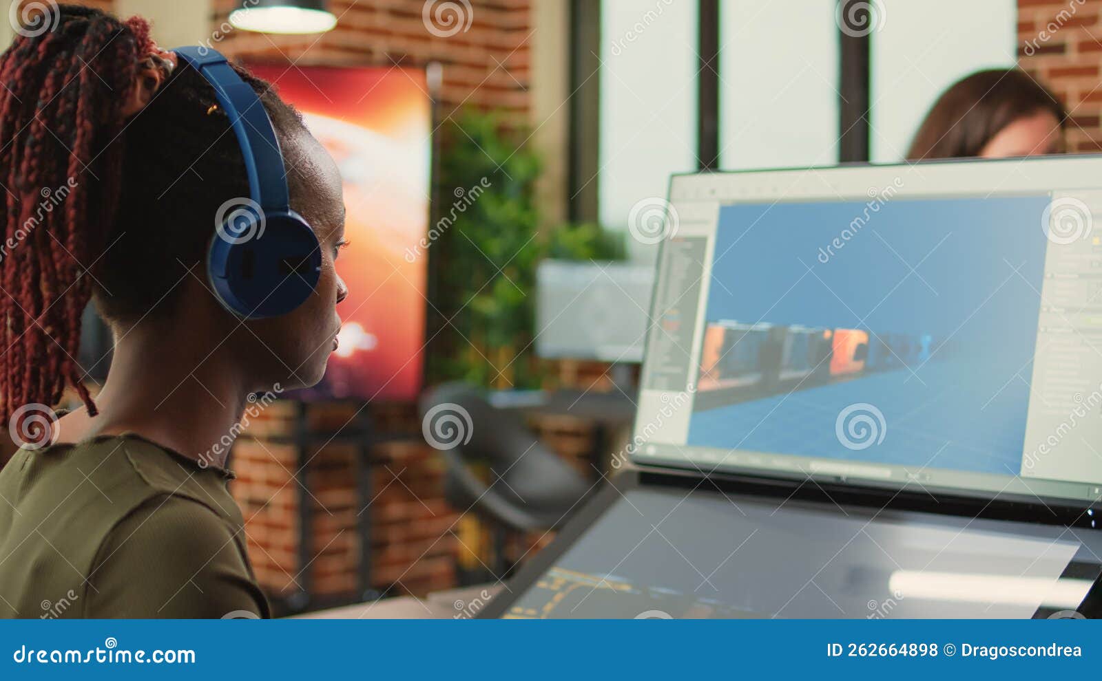 Female Creative Engineer Using Game Programming Software Stock Photo ...