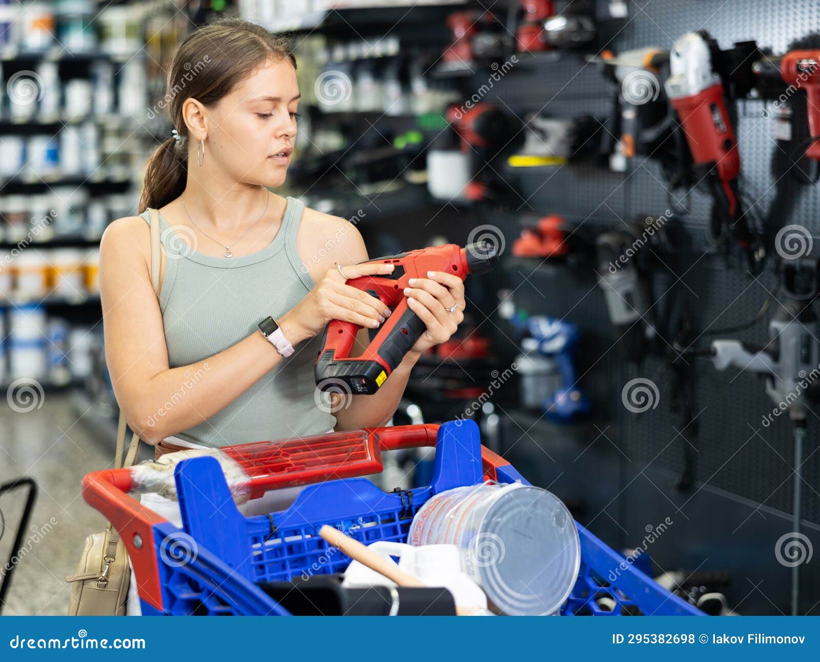 Female Customer Choosing Electric Drill in Hardware Store Stock Photo ...