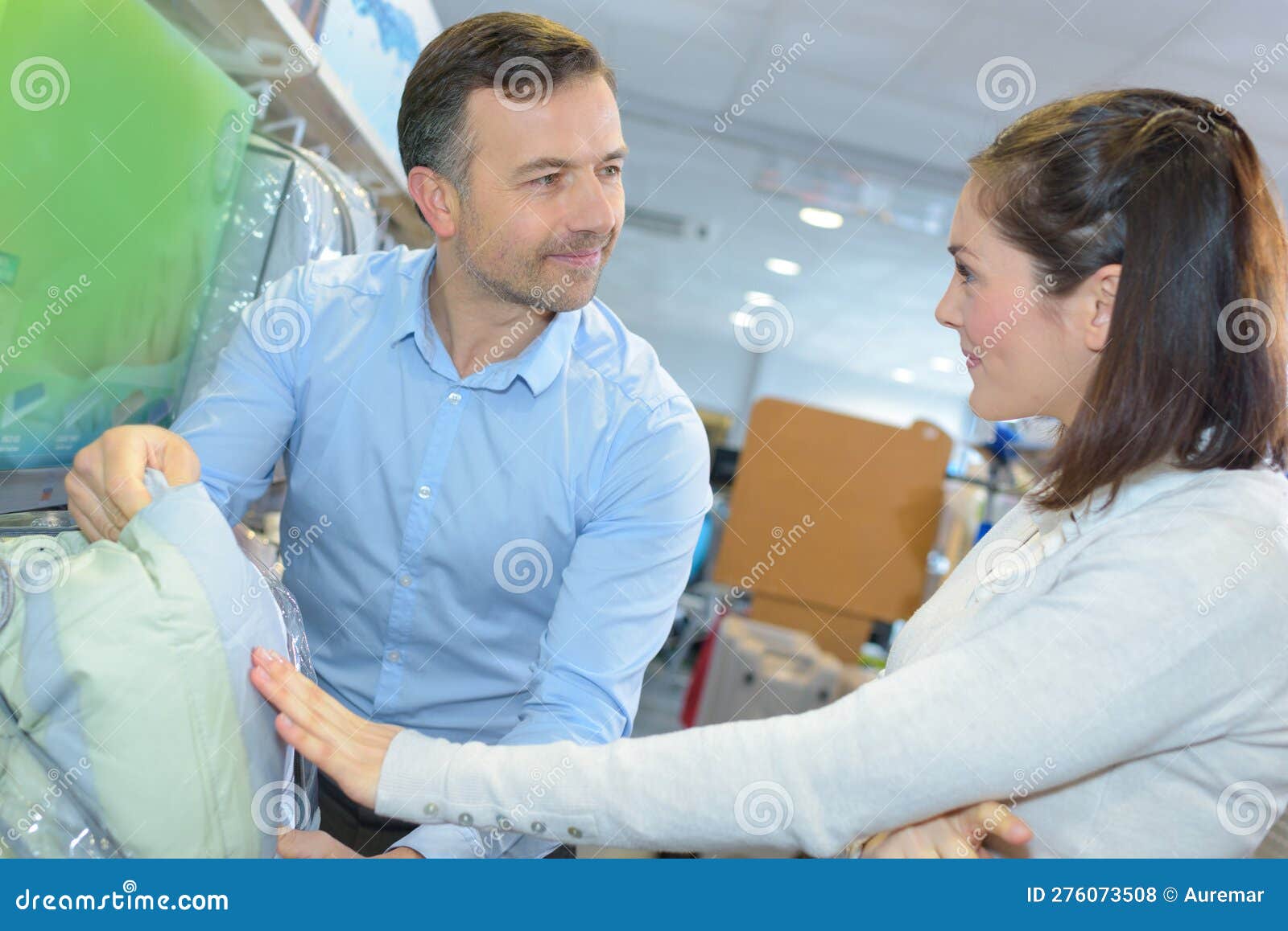 Female Customer Choosing Pillow in Bedding Section in Shop Stock Photo ...
