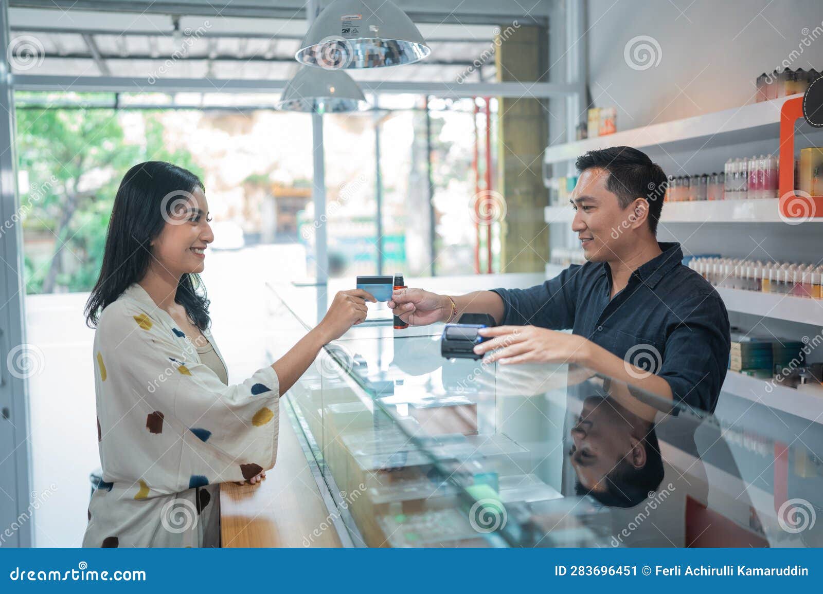 Female Customer Paying the Stuff Using the Credit Card Stock Image ...