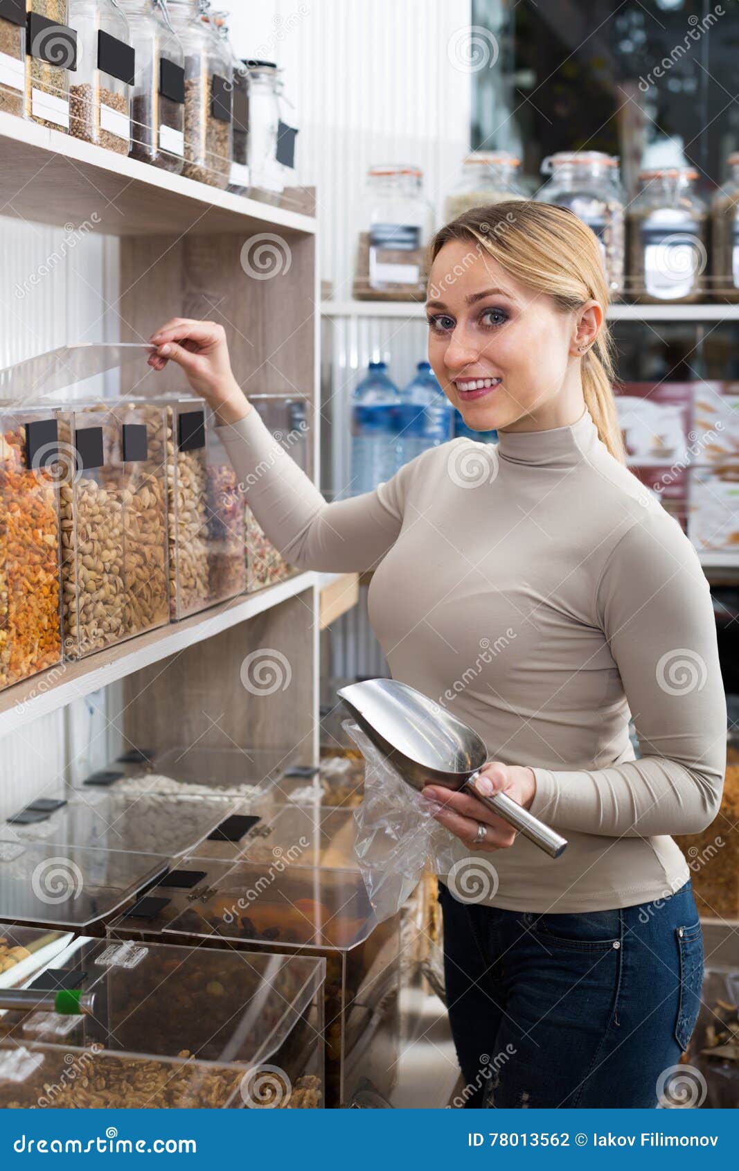 Female Customer Selecting Various Nuts Stock Photo - Image of boutique ...
