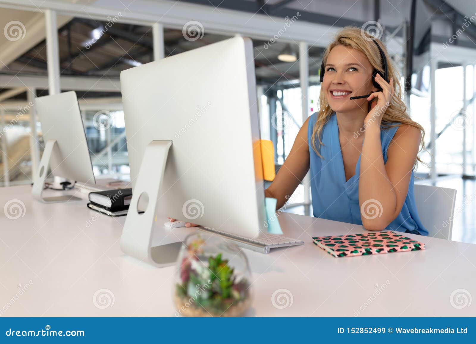 Female Customer Service Executive Talking on Headset at Desk Stock ... Female Customer Service Executive Talking on Headset at Desk Stock ...