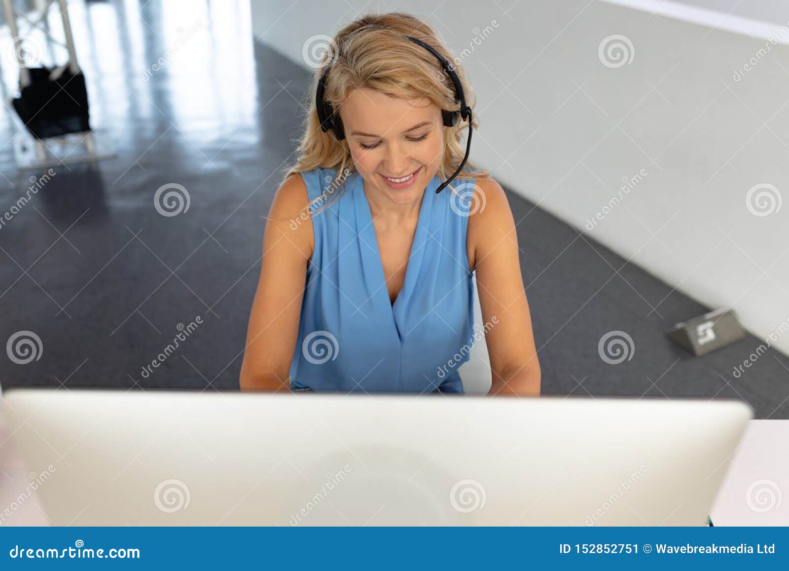 Female Customer Service Executive Talking on Headset at Desk Stock ... Female Customer Service Executive Talking on Headset at Desk Stock ...