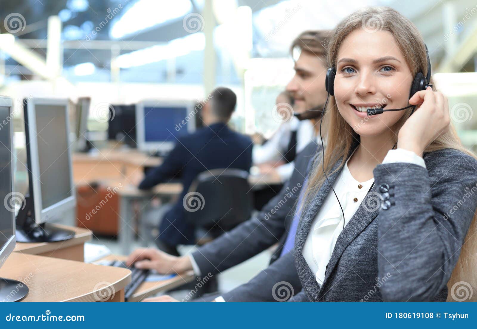 Female Customer Support Operator with Headset and Smiling Stock Photo ...