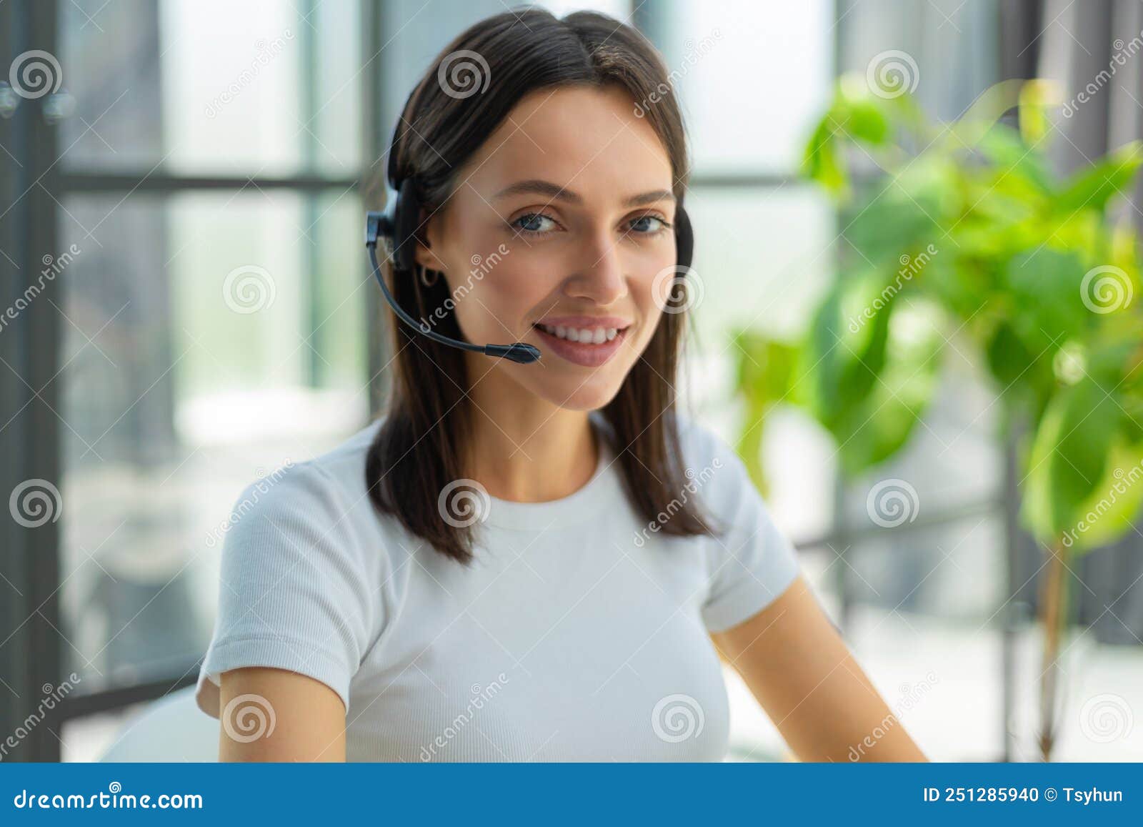 Female Customer Support Operator with Headset and Smiling Stock Photo ...