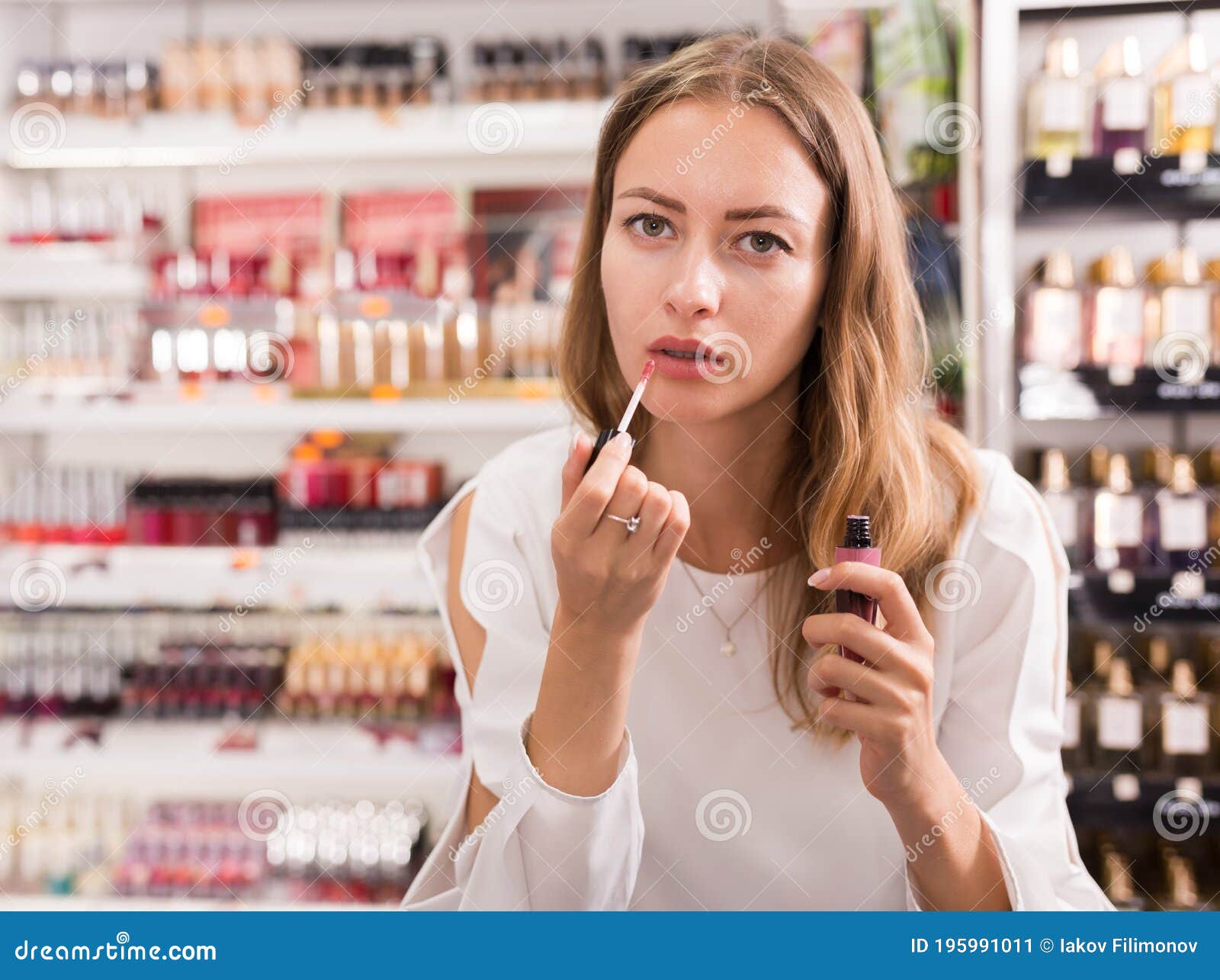 Female Customer Testing Lip Gloss Stock Image - Image of inside ...