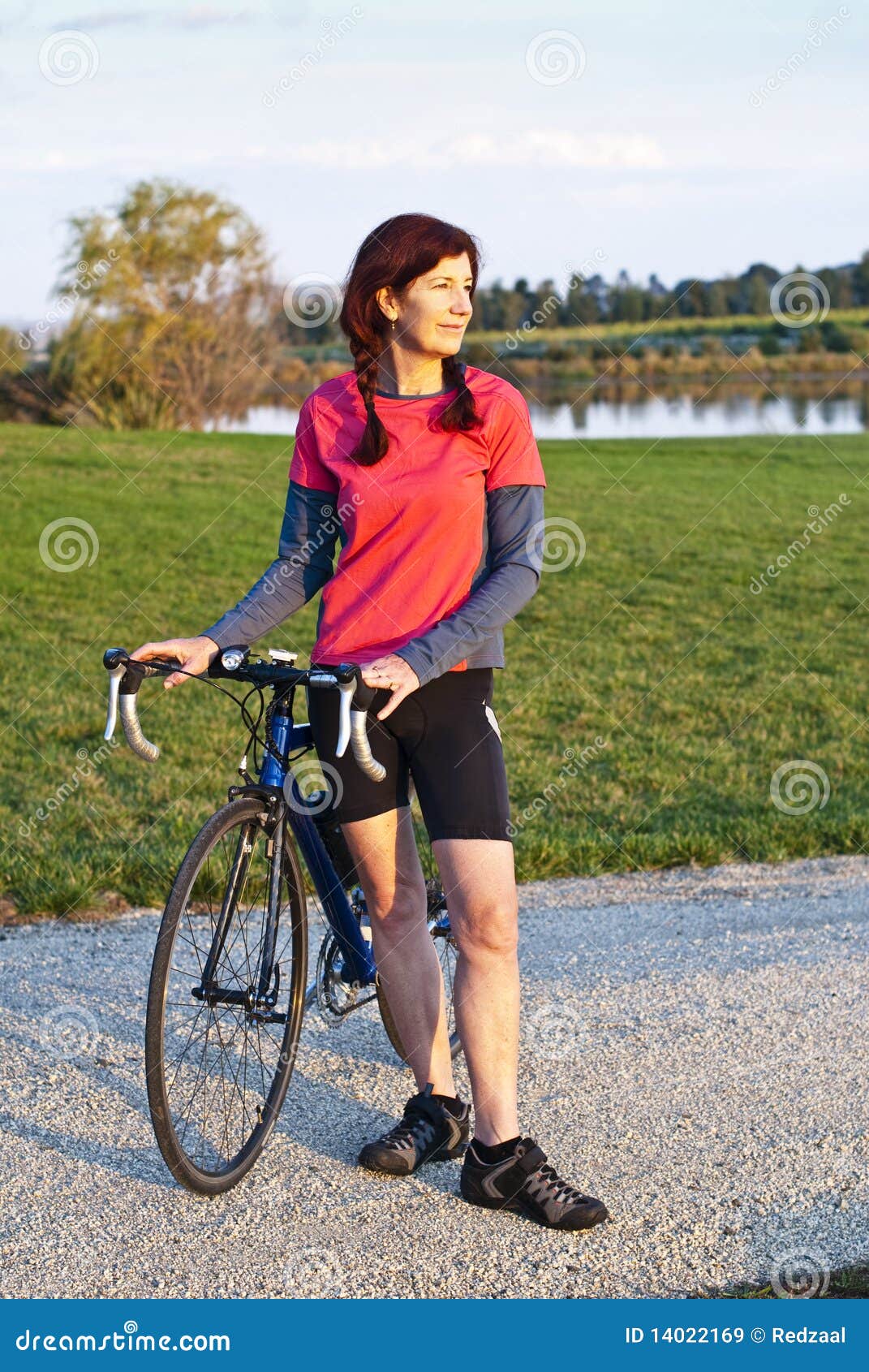 Female Cyclist in Golden Light Stock Image - Image of fitness, bike ...