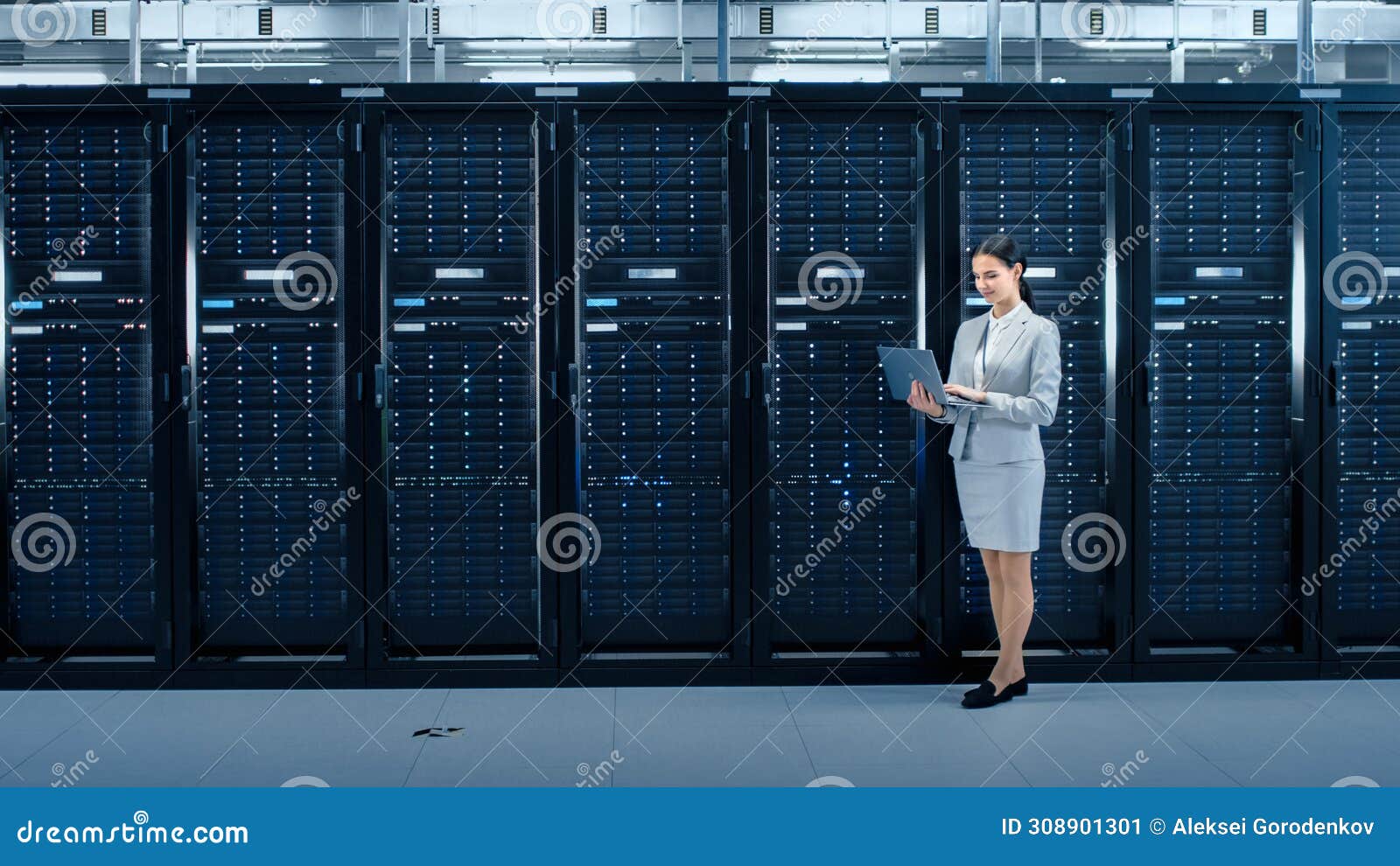 Female Data Center it Engineer Works on Laptop Computer Next To Server ...