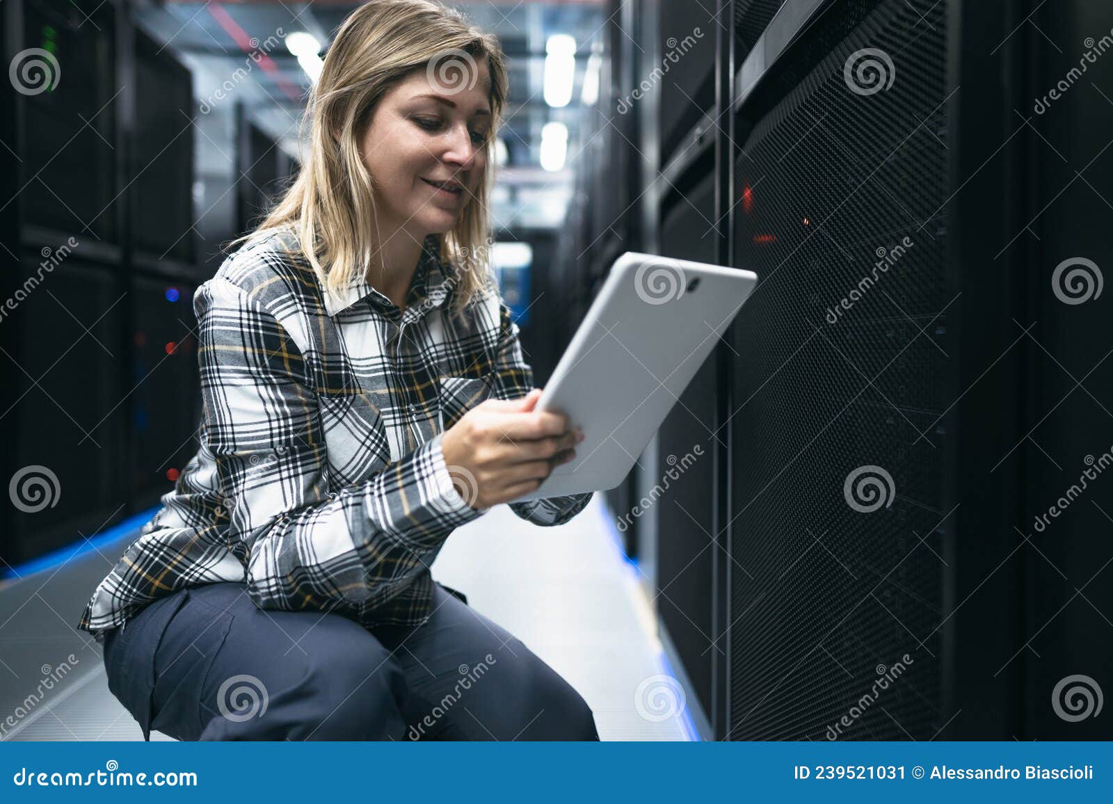 Female Data Center Technician Working Inside Server Room Stock Image ...