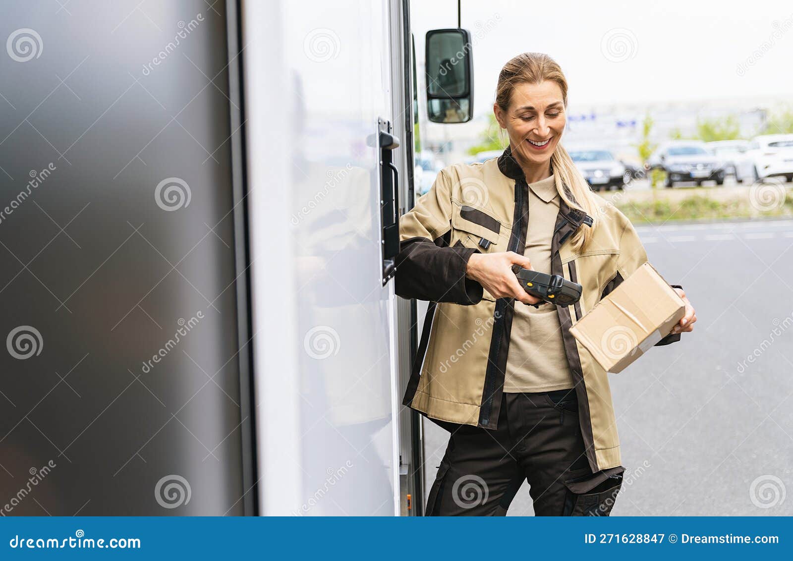 Female Delivery Agent Scanning Barcode with Barcode Scanner Outside of ...