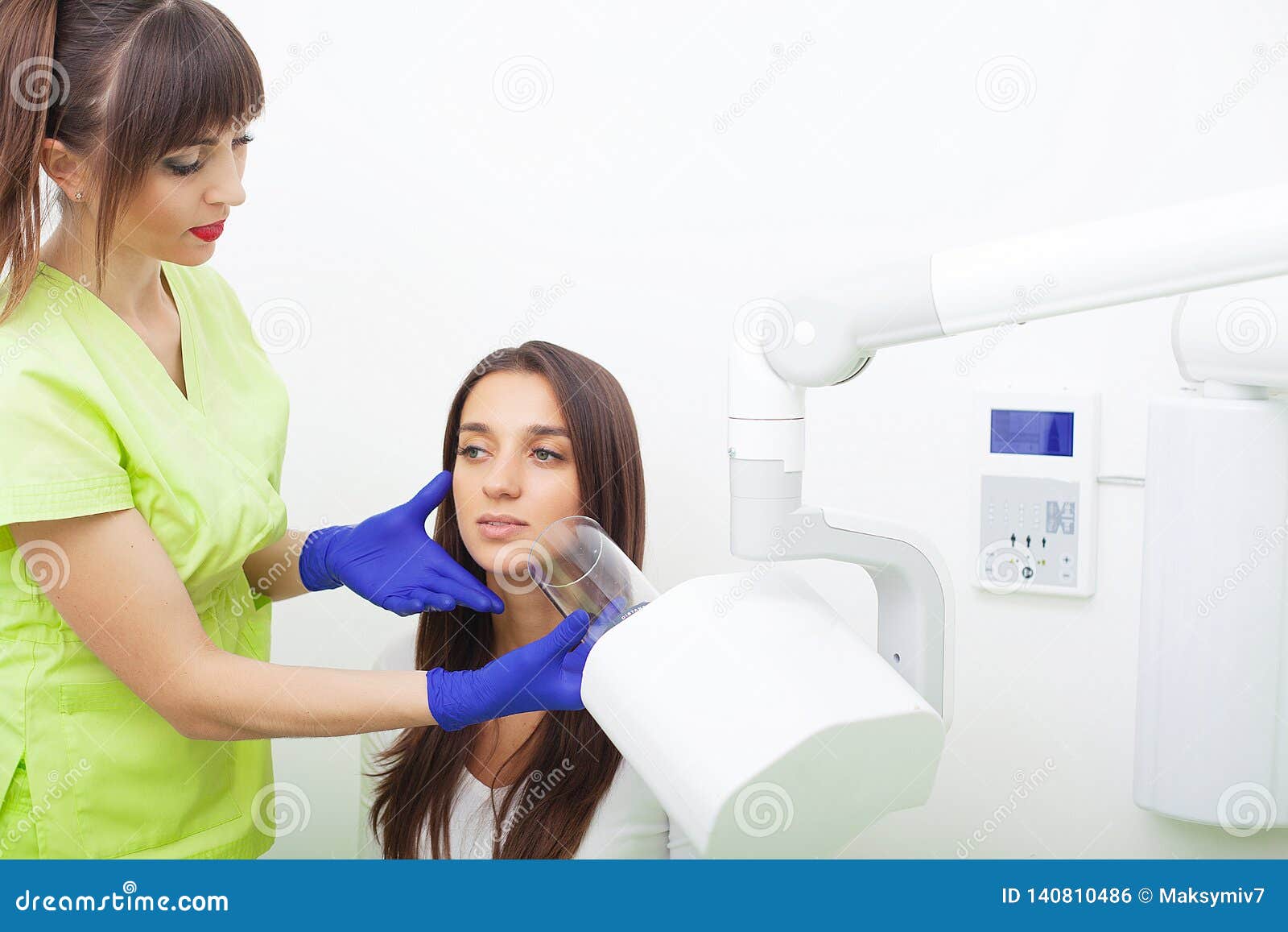 Female Dentist Taking an X-ray of a Female Patient`s Teeth Stock Photo ...
