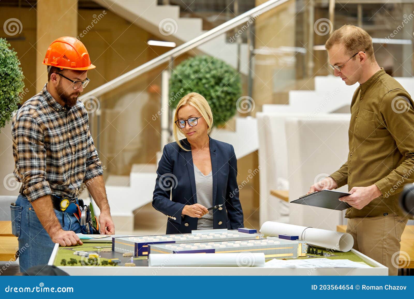 Female Designer Architect Give Directions To Engineers Stock Photo ...